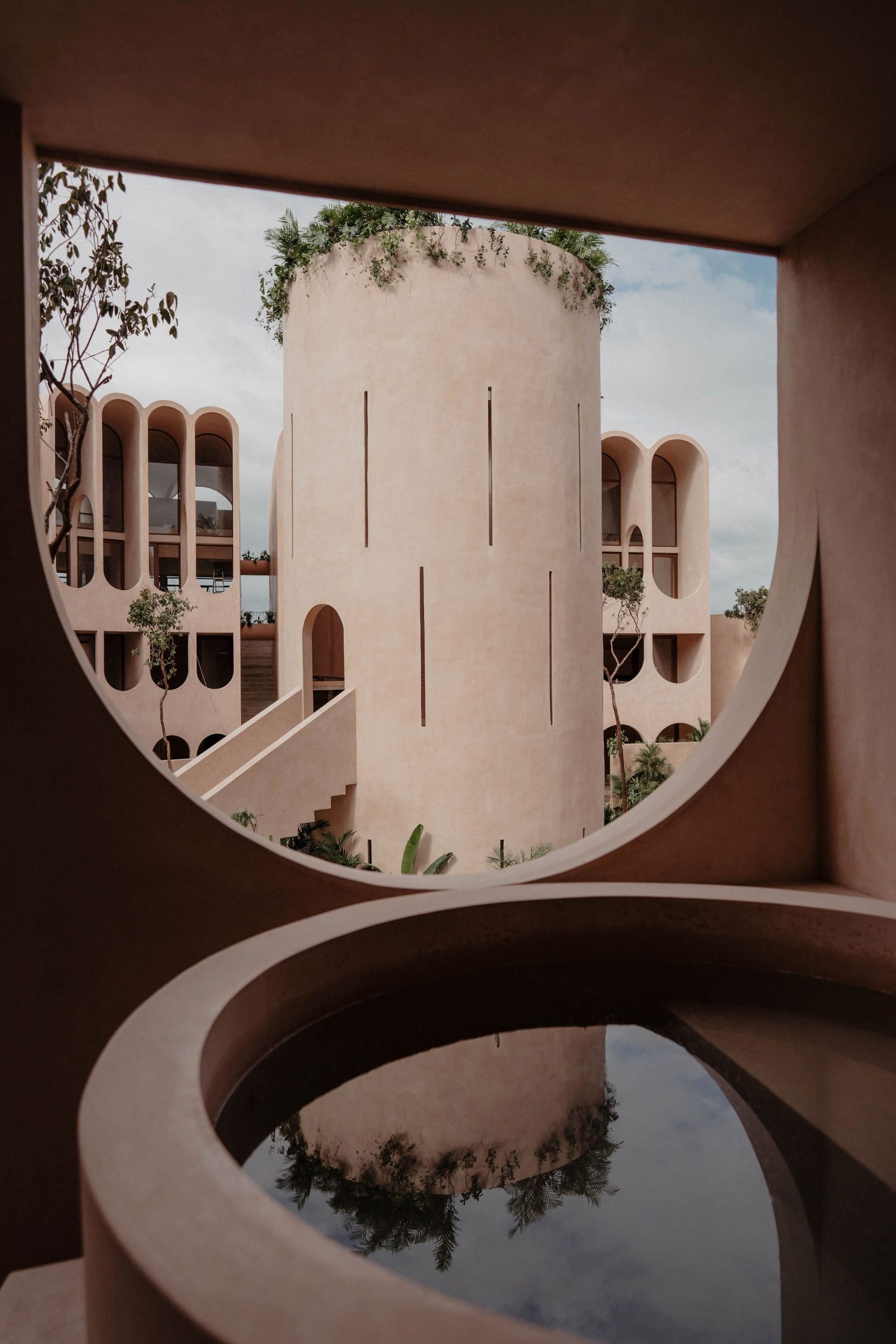 news: earthy-pink babel housing in tulum bridges ancient symbolism with ...