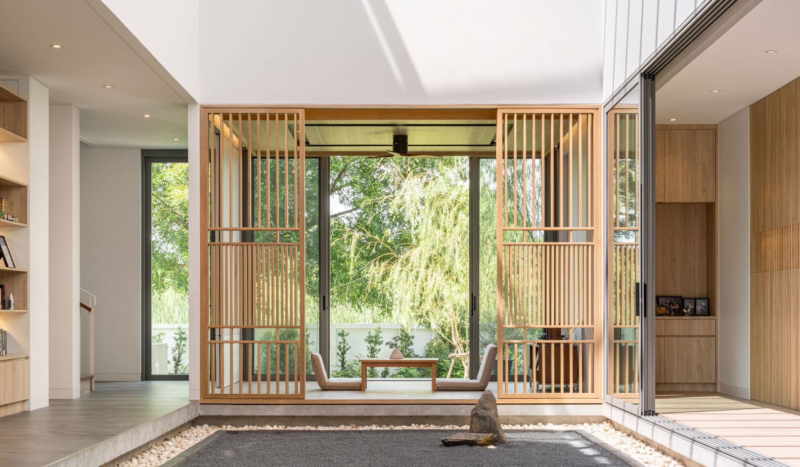 aomo highlights japanese-inspired stone courtyard at a modern house in ...