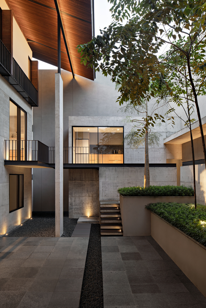 hideout house celebrates indoor-outdoor connection around a shallow ...