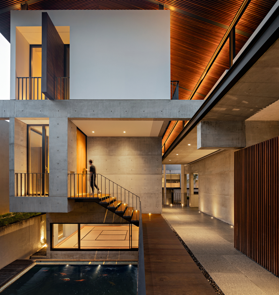 hideout house celebrates indoor-outdoor connection around a shallow ...