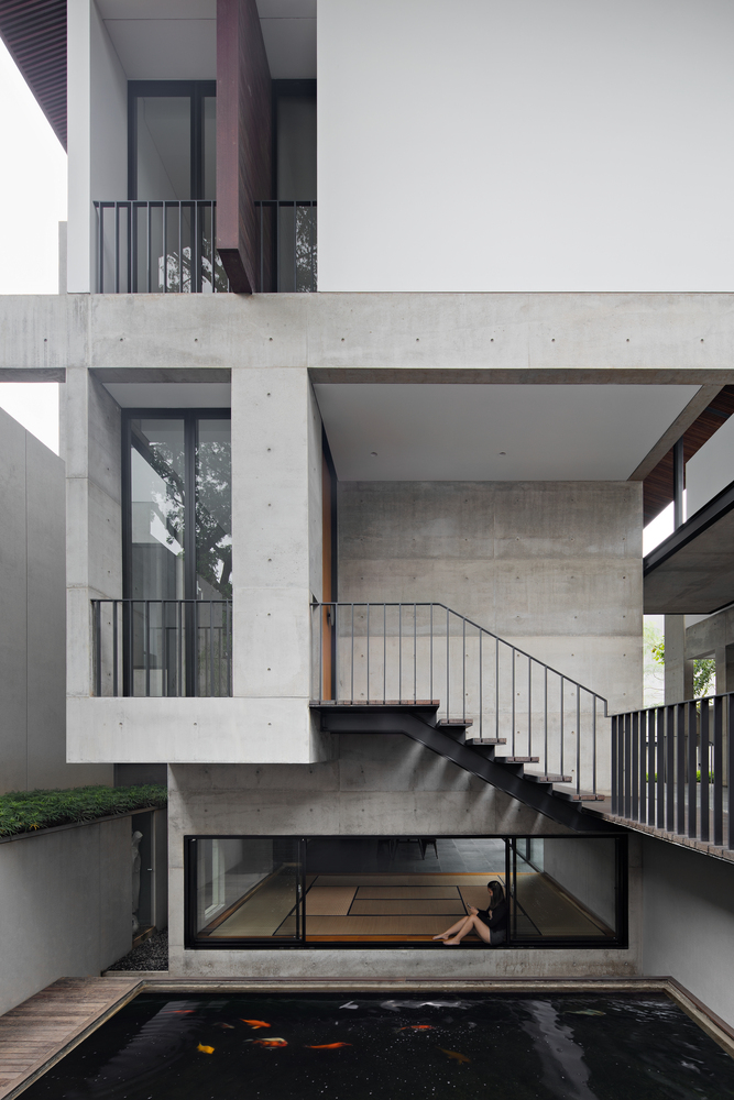 hideout house celebrates indoor-outdoor connection around a shallow ...