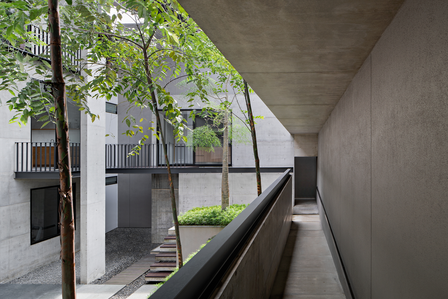 hideout house celebrates indoor-outdoor connection around a shallow ...