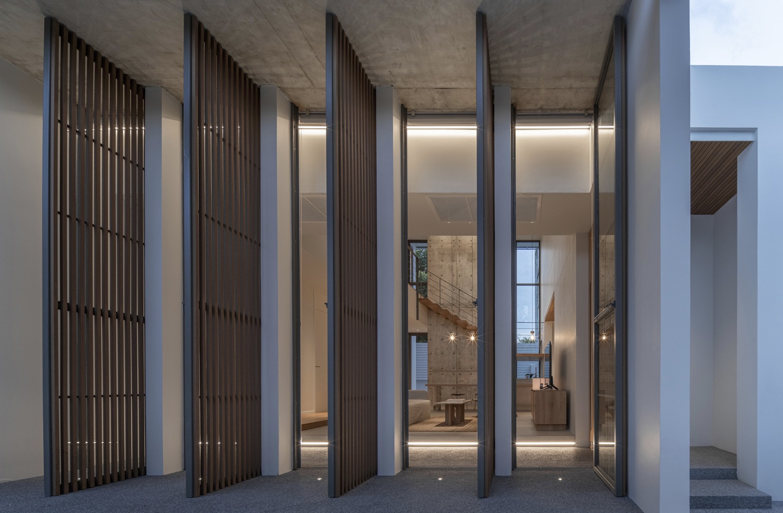 a house in thailand enclosed in massive concrete and minimalistic ...