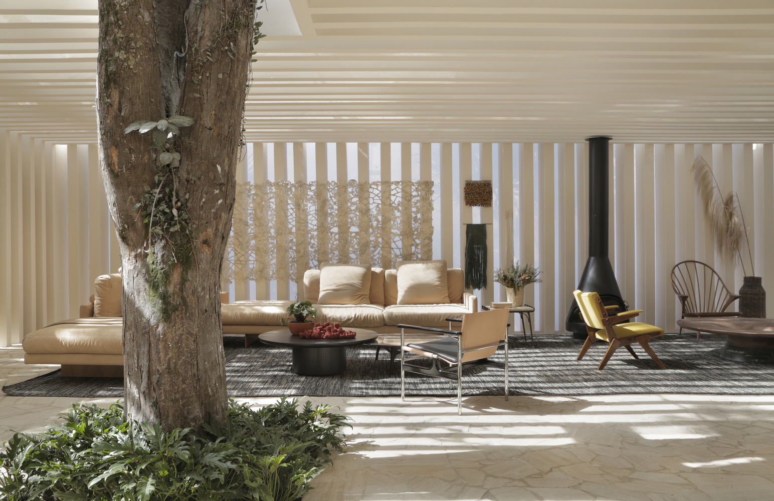 news: 7 contemporary home designs with indoor trees | the design story