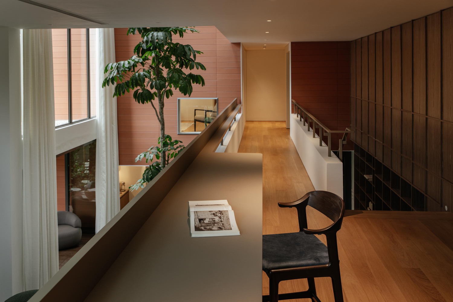 in between house is a courtyard sanctuary of light, brick, and trees ...