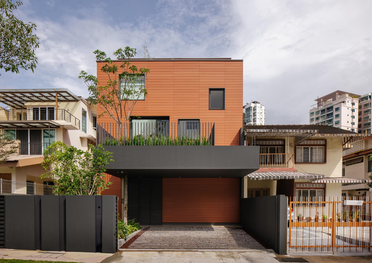 in between house is a courtyard sanctuary of light, brick, and trees ...