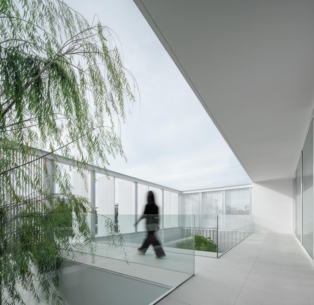 veil house sparks ethereality using translucent screens and courtyards ...